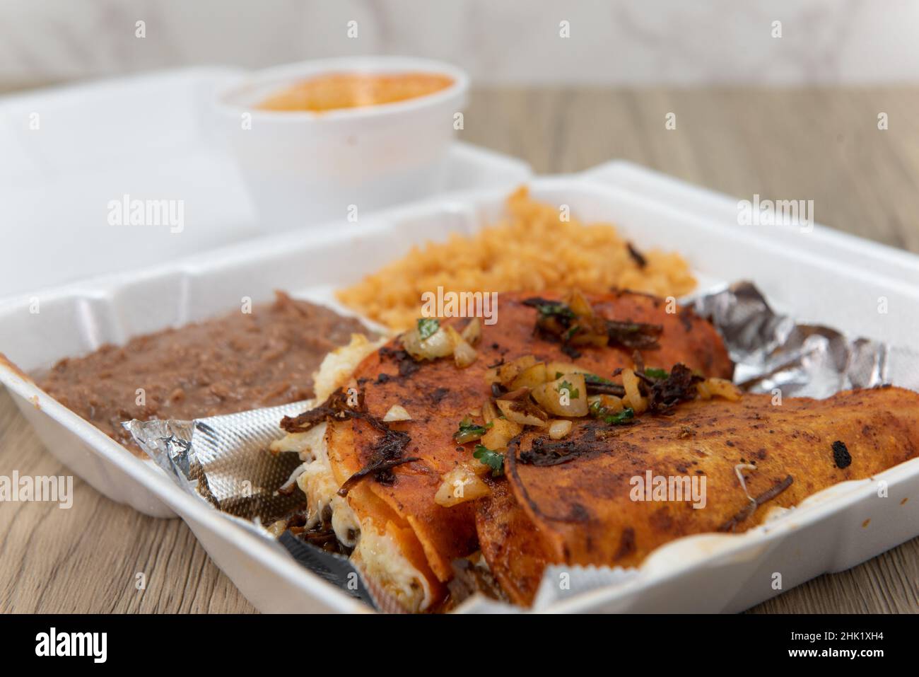 Take out order of birria tacos deep fried to perfection with rice and ...