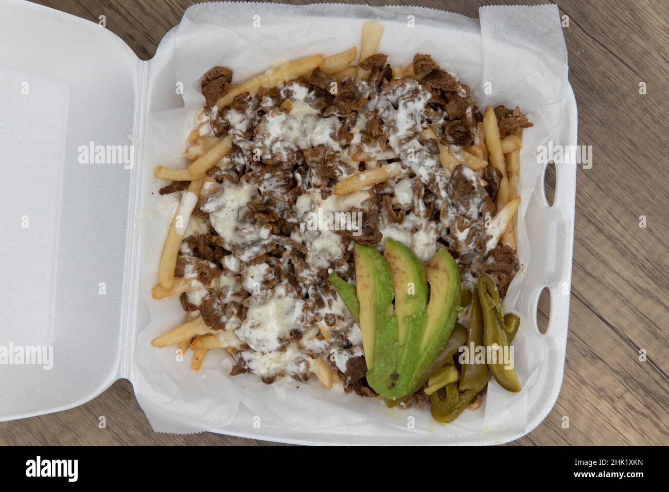 Overhead View Of Take Out Order Of Carne Asada French Fries Covered In