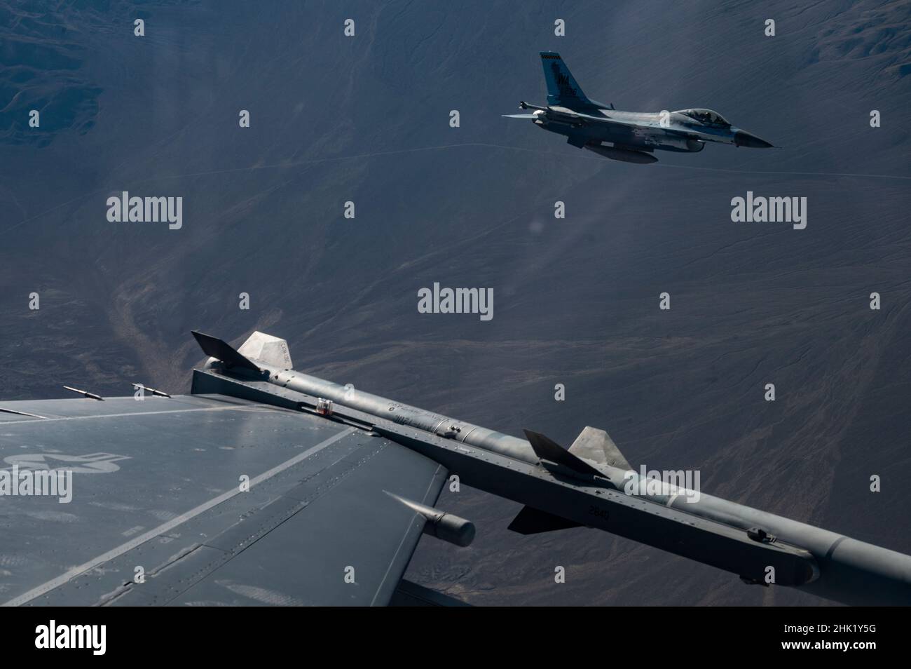 An F-16C Fighting Falcon from the 64th Aggressor Squadron flies as a ...