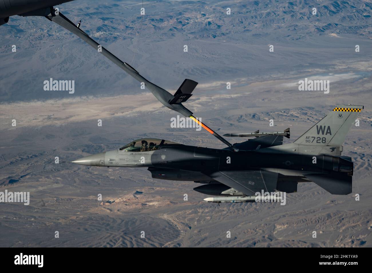 An F 16 Fighting Falcon Assigned To The 64th Aggressor Squadron Receives Inflight Fuel During A an-f-16-fighting-falcon-assigned-to-the-64th-aggressor-squadron-receives-inflight-fuel-during-a
