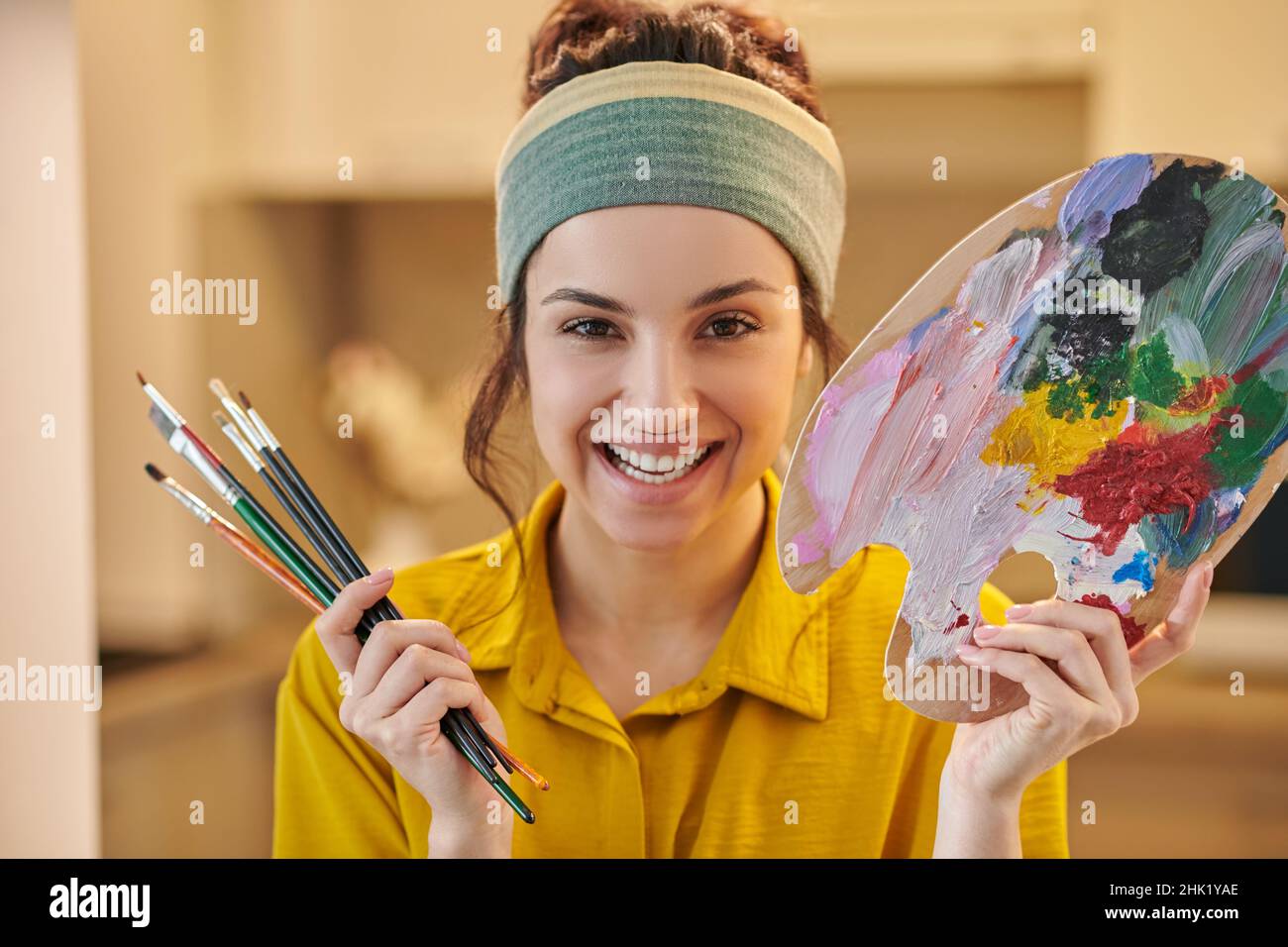 Cute female artist looking happy and enjoyed Stock Photo - Alamy