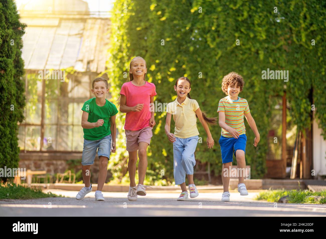 Boy running in sunny hi-res stock photography and images - Alamy