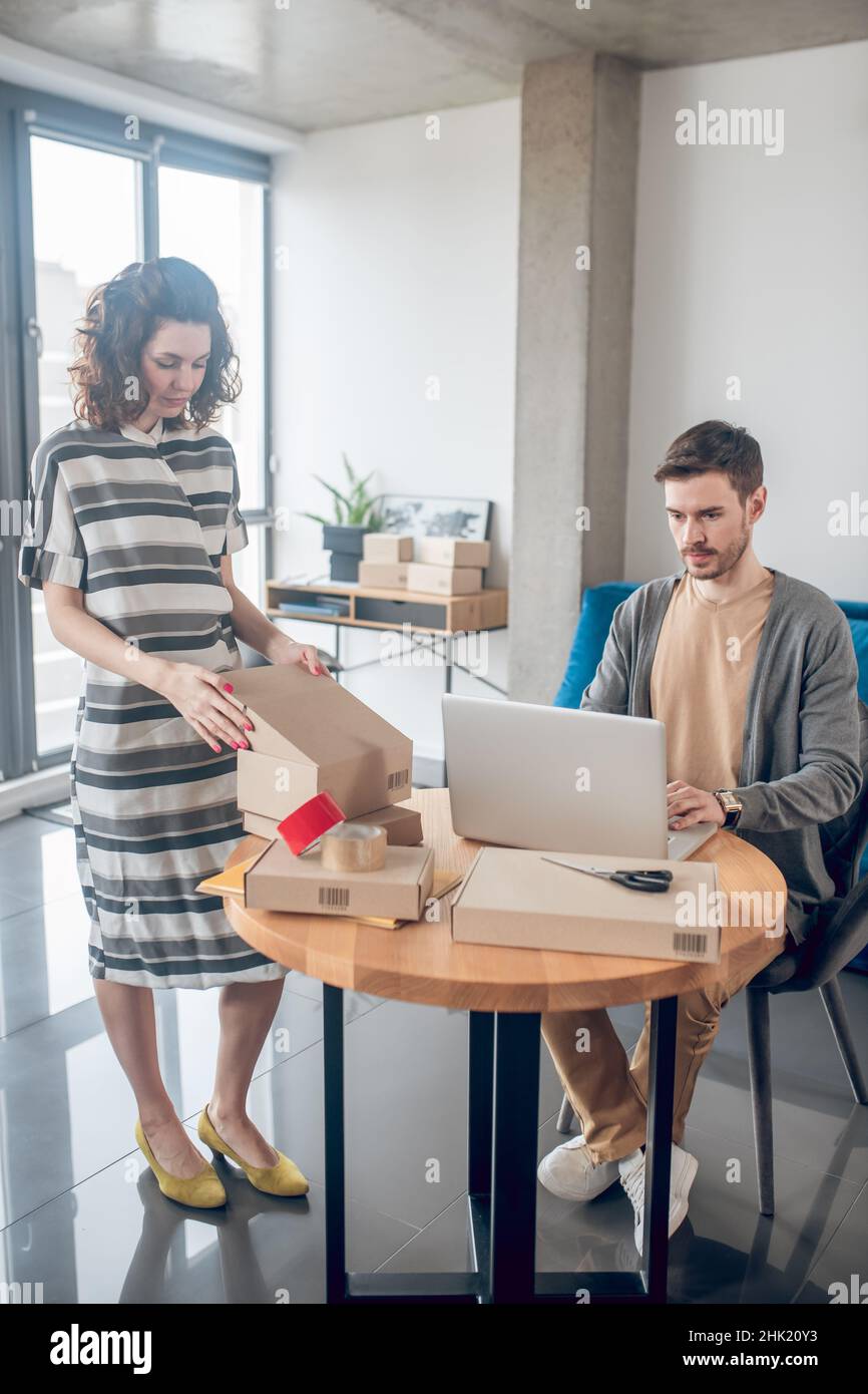 Internet store workers concentrated on their work Stock Photo - Alamy