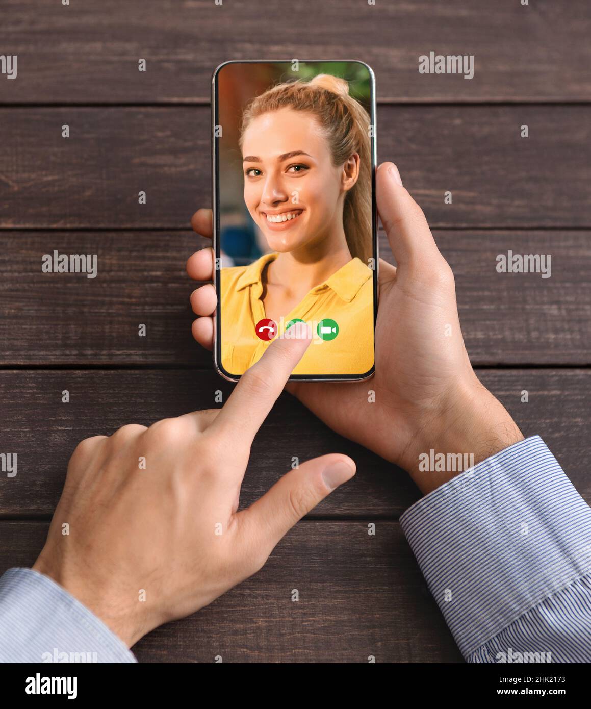 Guy holding cellphone in hand video calling friend Stock Photo - Alamy