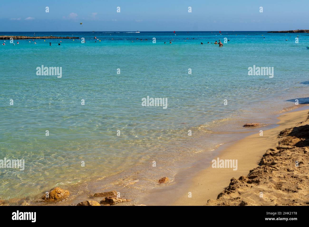 Crystal clear blue water of Mediterranean sea on white sandy Fig tree ...