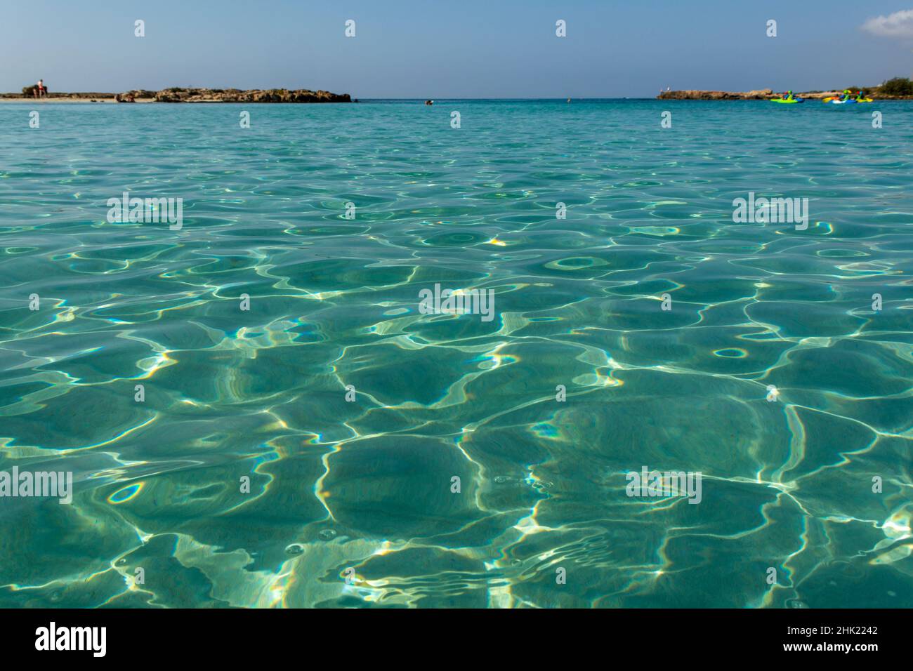 Crystal clear blue water of Mediterranean sea on white sandy Nissi ...