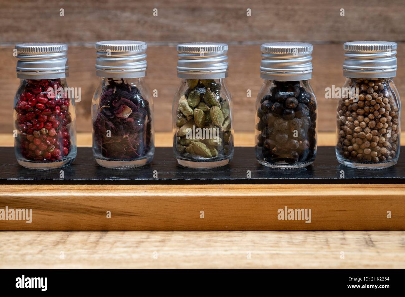 Professional set of gin spices in small bottles, pink pepper, hibiscus ...