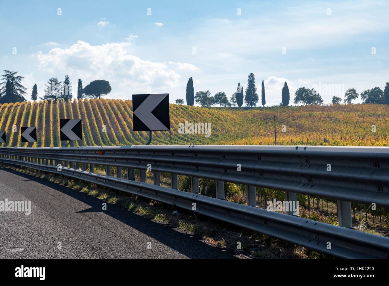 Driving car on Italian highway with view on Chianti vineyards on hills ...
