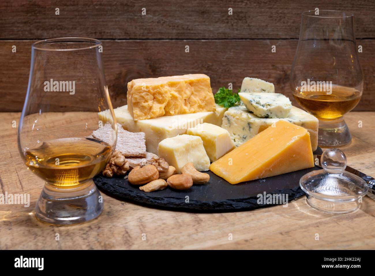 British drinks and food pairing, glasses of Scotch whisky and cheeses ...