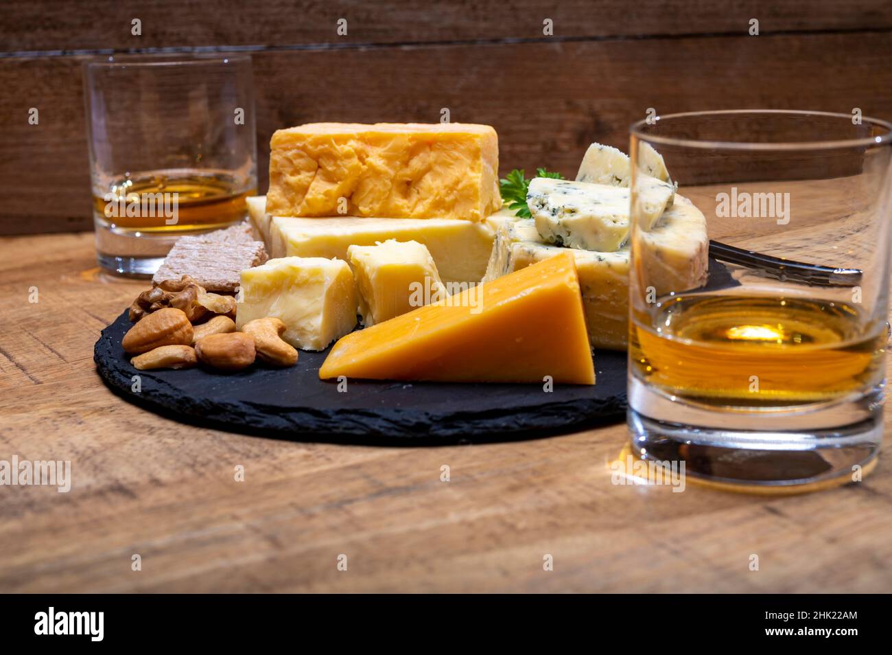 British drinks and food pairing, glasses of Scotch whisky and cheeses ...