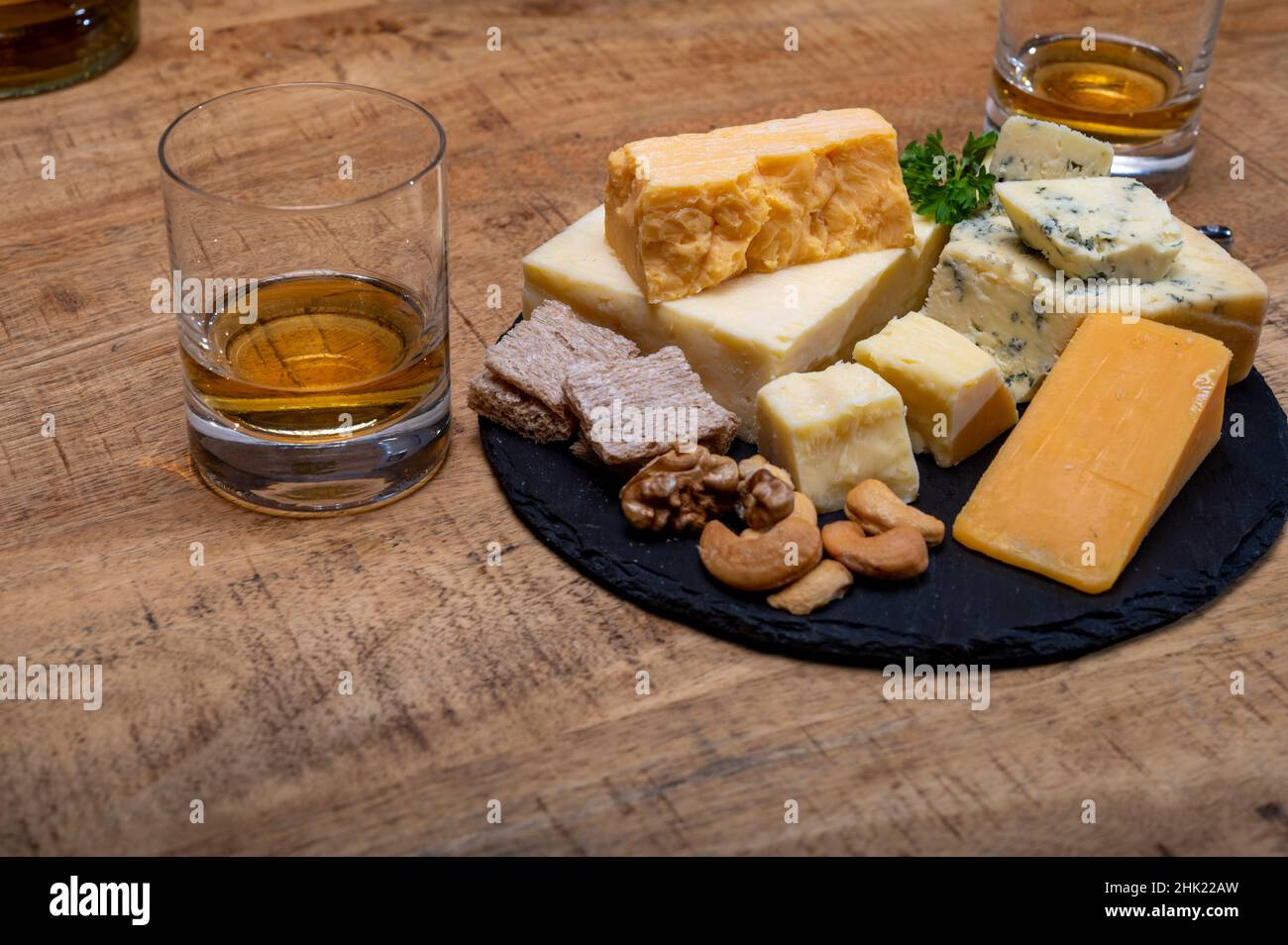 British drinks and food pairing, glasses of Scotch whisky and cheeses ...