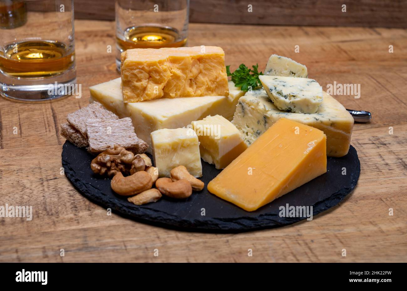 British drinks and food pairing, glasses of Scotch whisky and cheeses ...