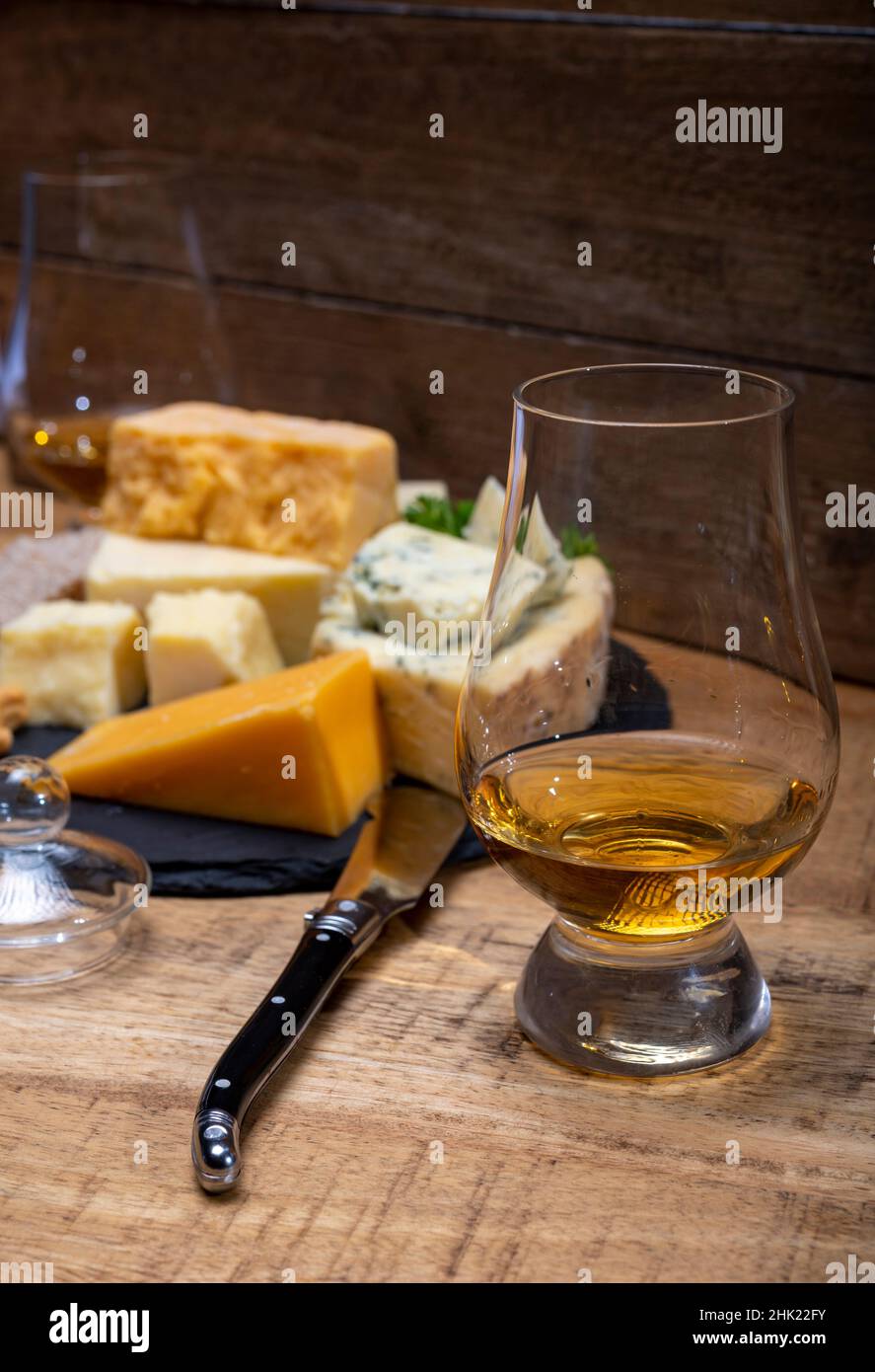 British drinks and food pairing, glasses of Scotch whisky and cheeses ...