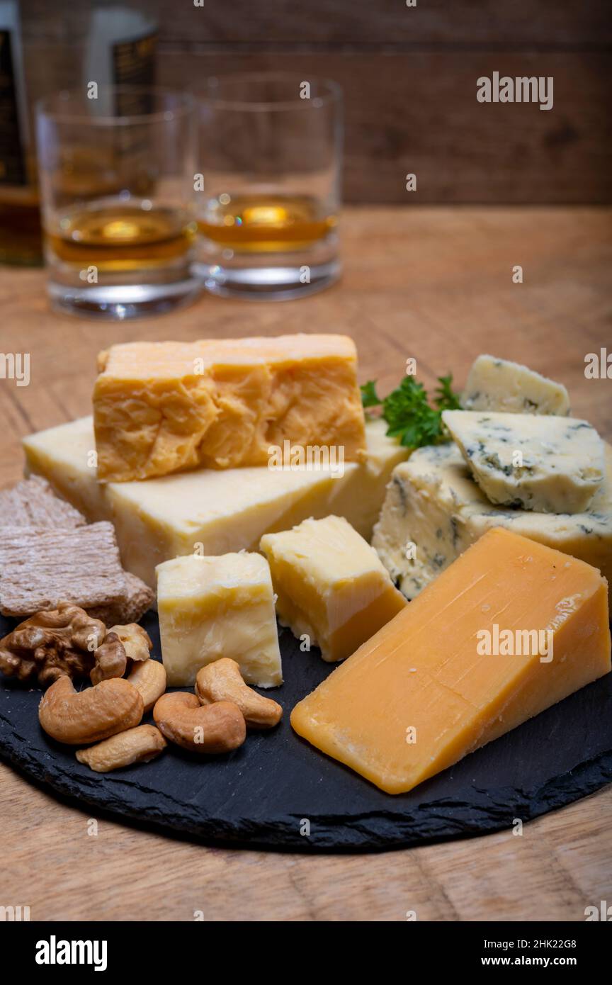 British drinks and food pairing, glasses of Scotch whisky and cheeses ...