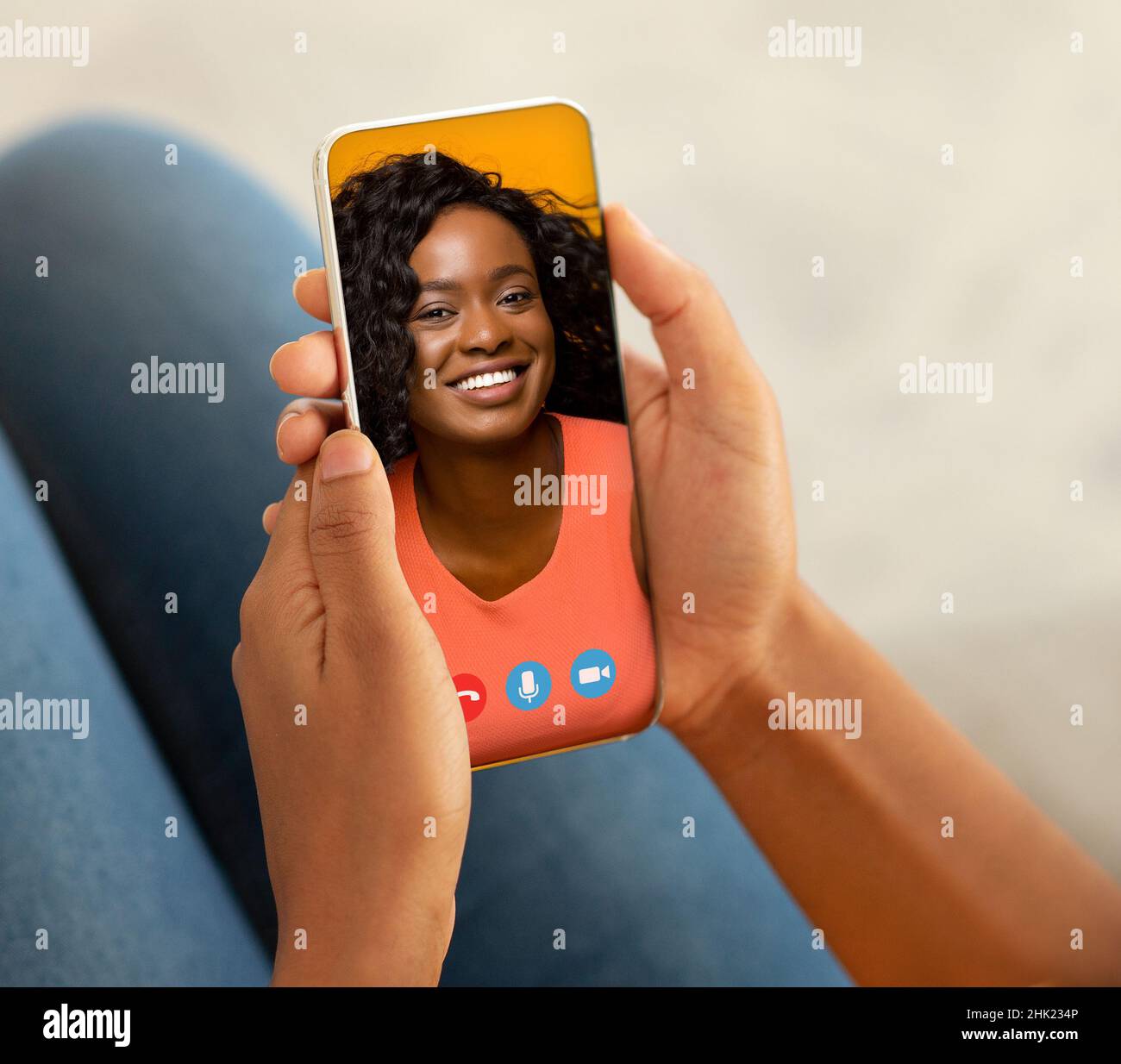 Unrecognizable lady holding smartphone and making video call with her ...