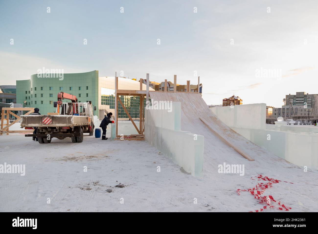 The builder cleans the ice panel with a wire brush from snow Stock ...