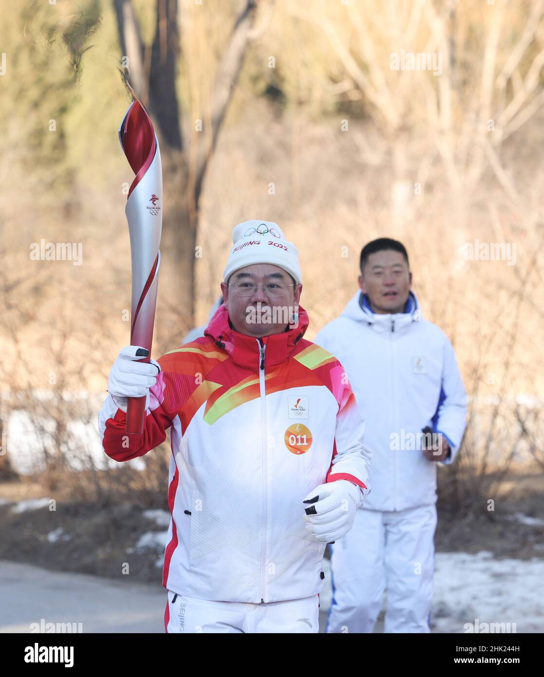 Beijing, China. 2nd Feb, 2022. Torch bearer Wu Ming runs with the torch during the Beijing 2022 ...