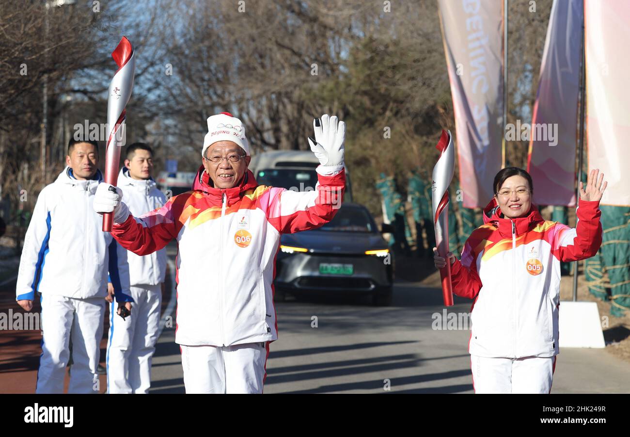 Beijing, China. 2nd Feb, 2022. Torch bearers Liu Zhijie (L front) and ...
