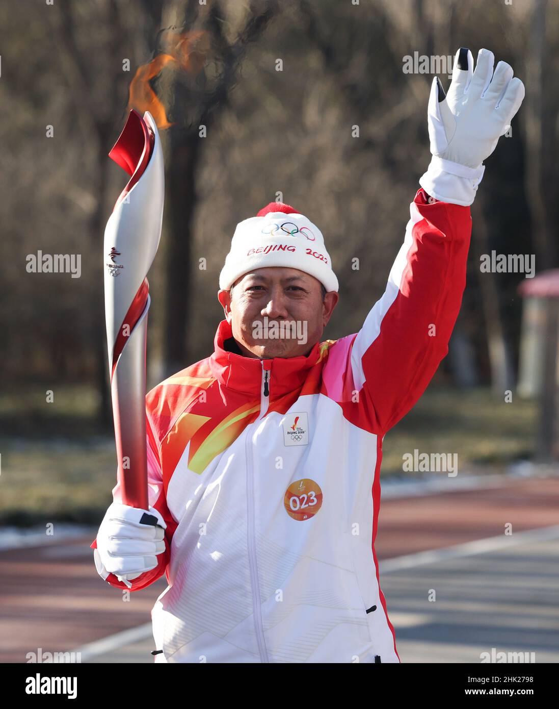 Beijing, China. 2nd Feb, 2022. Torch bearer Wang Lin runs with the torch during the Beijing 2022 ...