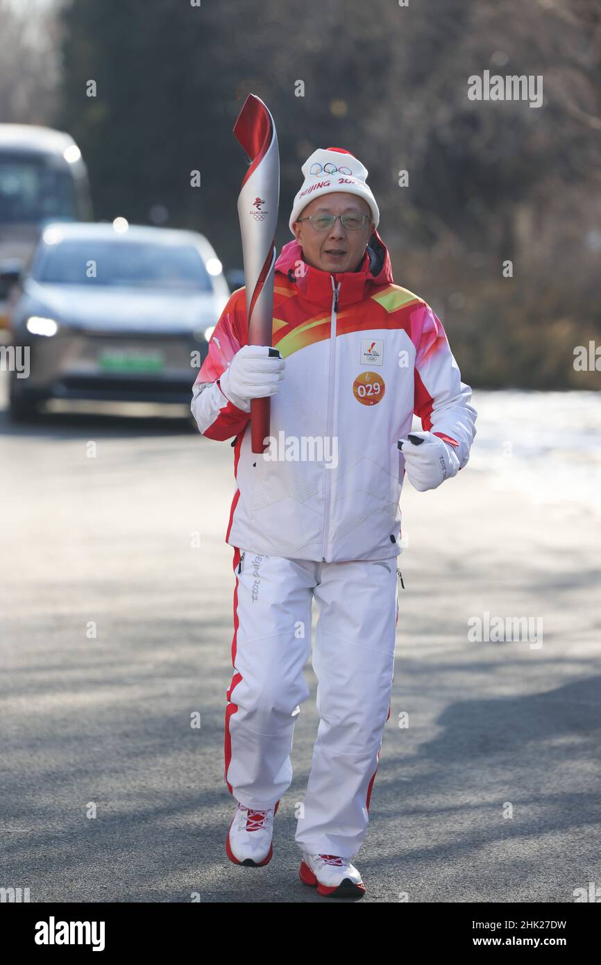 Beijing, China. 2nd Feb, 2022. Torch bearer Yang Zhong runs with the torch during the Beijing ...