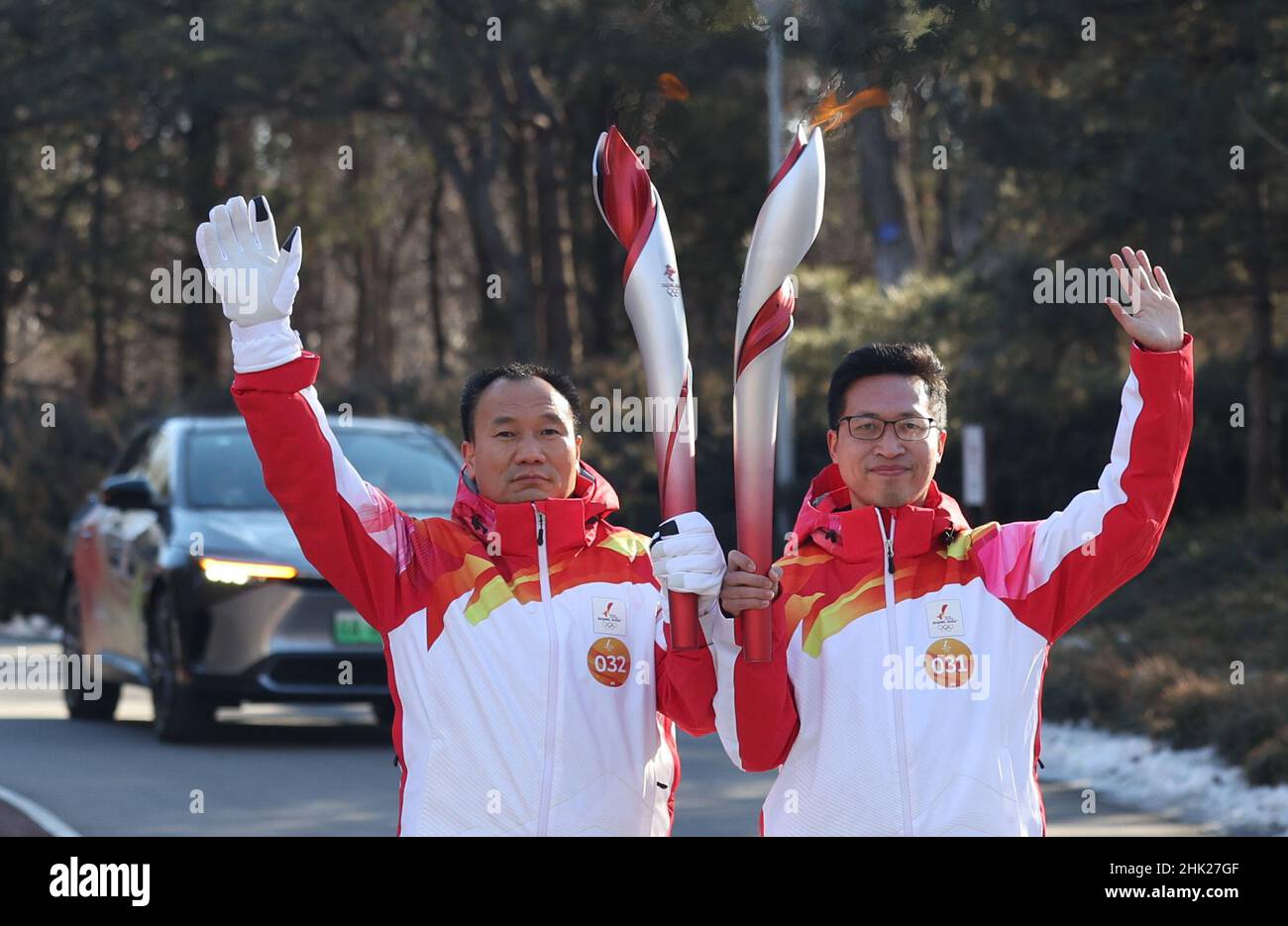 Beijing, China. 2nd Feb, 2022. Torch bearers Li Yonghong (L) and Shi ...