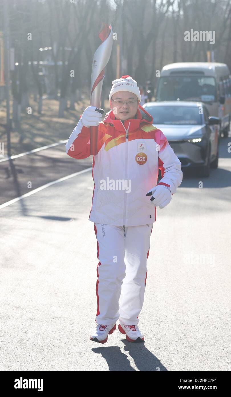Beijing, China. 2nd Feb, 2022. Torch bearer Luo Shuangwu runs with the ...