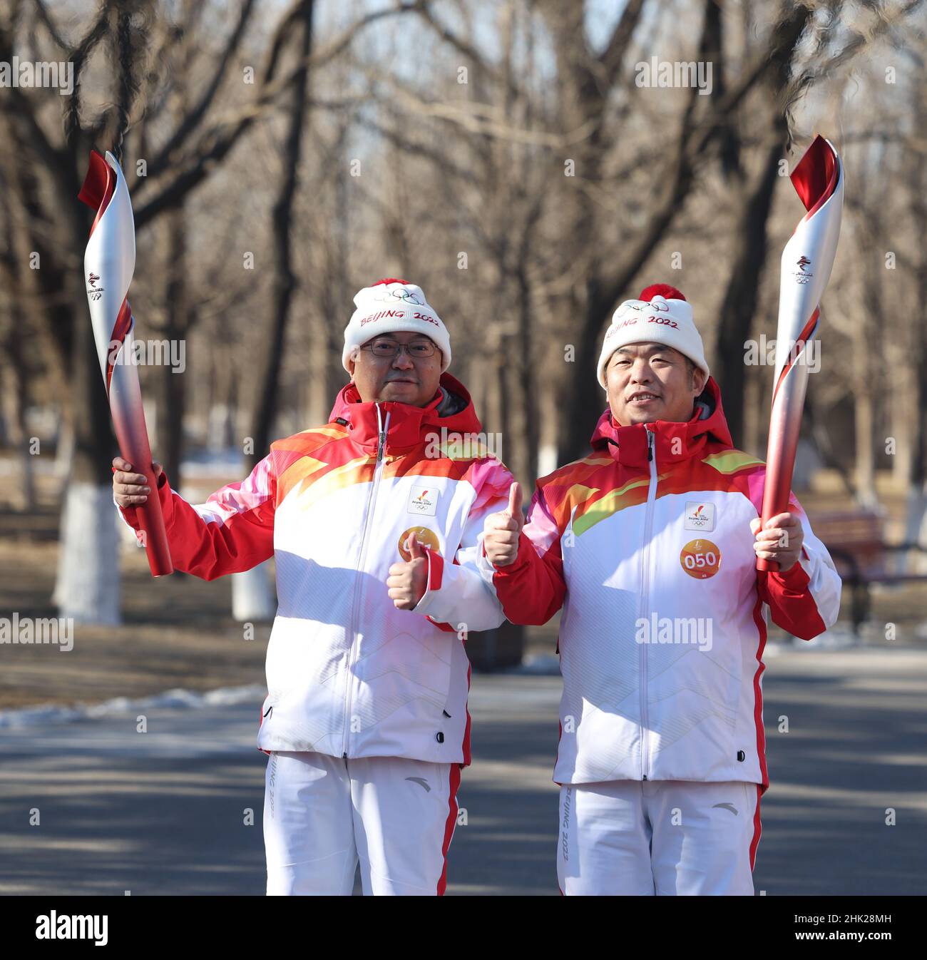 Beijing, China. 2nd Feb, 2022. Torch bearers Zhang Hu (L) and Fu Yanjun ...