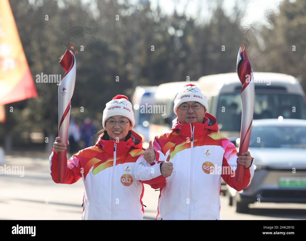 Beijing, China. 2nd Feb, 2022. Torch bearers Zhao Xuemei (L) and Zhang Hu attend the Beijing ...