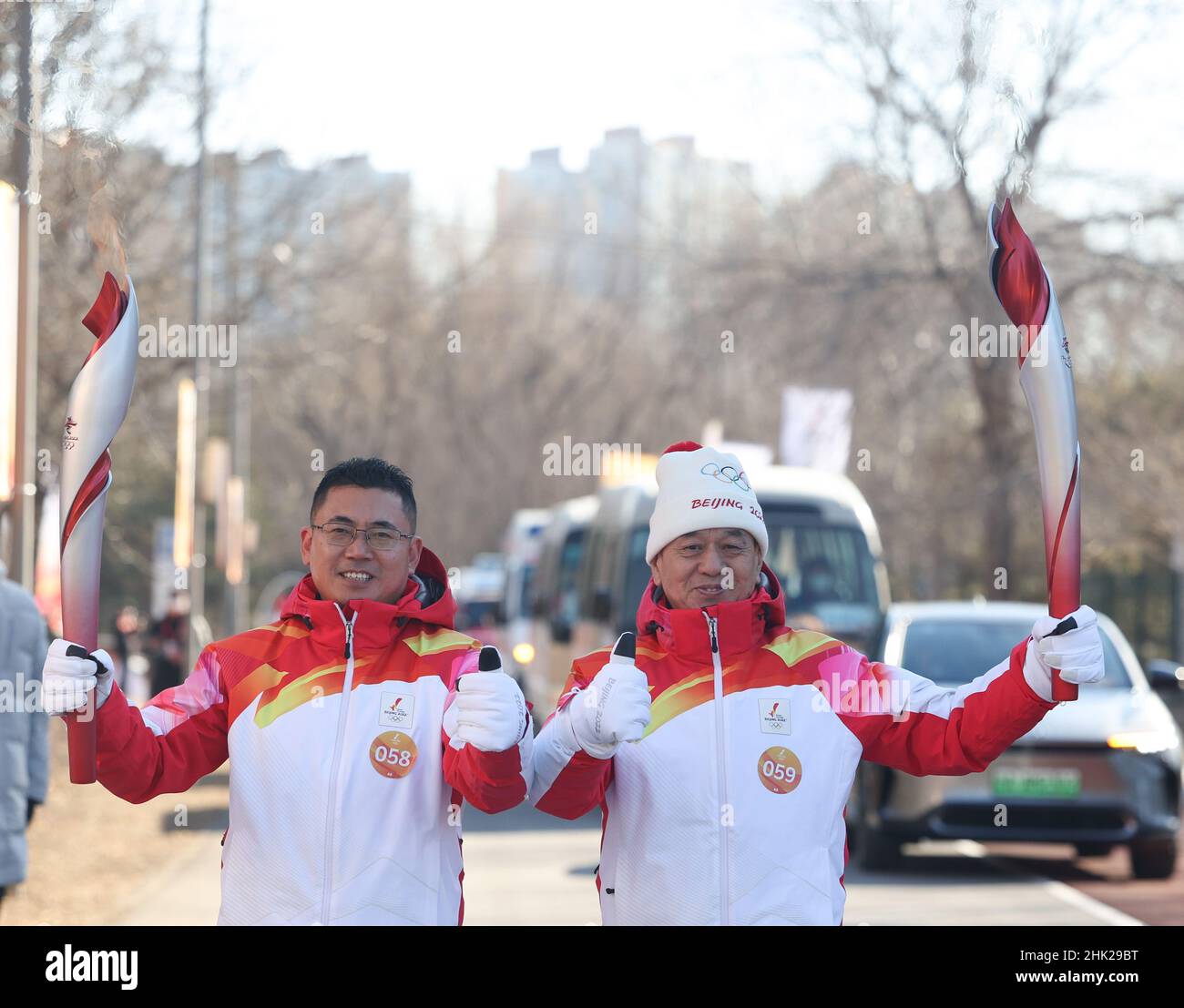Beijing, China. 2nd Feb, 2022. Torch bearers Fu Chunlai (R) and Fan ...