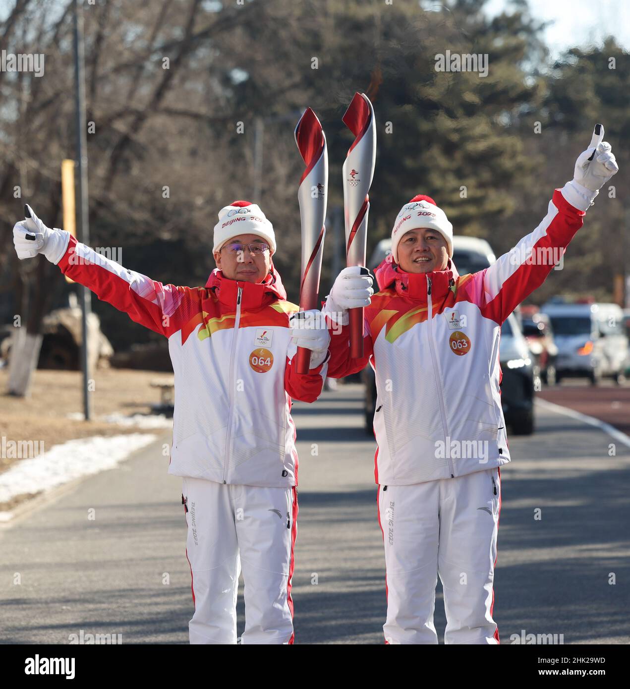 Beijing, China. 2nd Feb, 2022. Torch bearers Wu Yonghua (R) and Bi ...