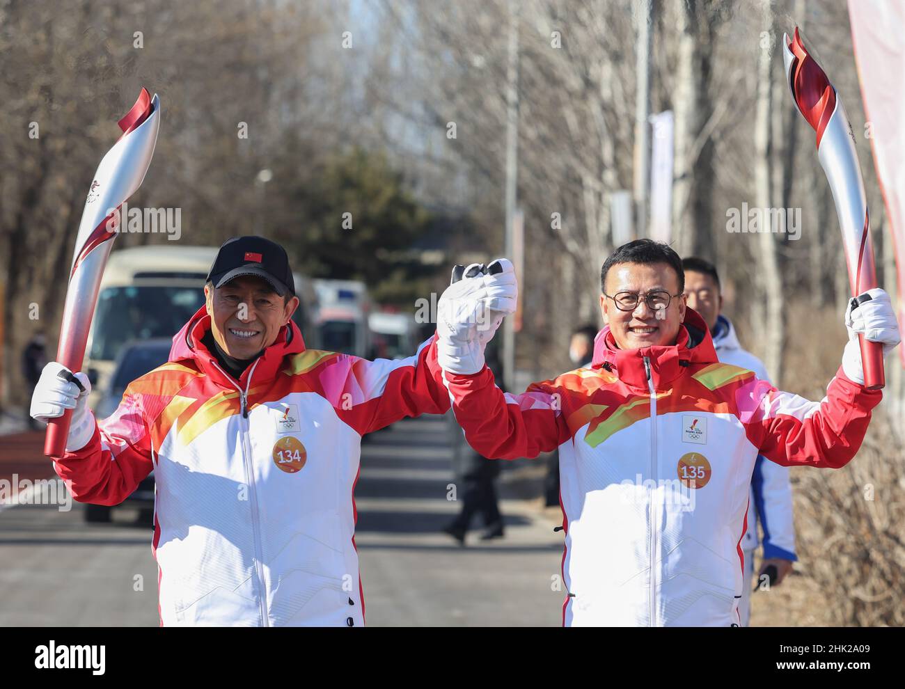 Beijing, China. 2nd Feb, 2022. Torch bearers Zhang Yimou (L) and Li ...