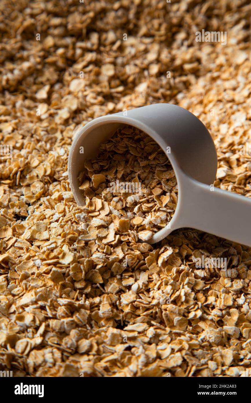 A closeup image of healthy dried oatmeal breakfast cereal with a large ...
