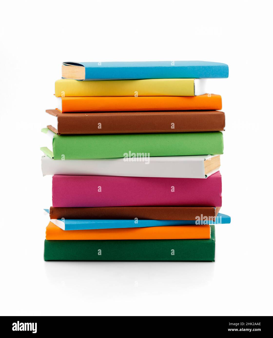 stack of colorful books on white background Stock Photo - Alamy