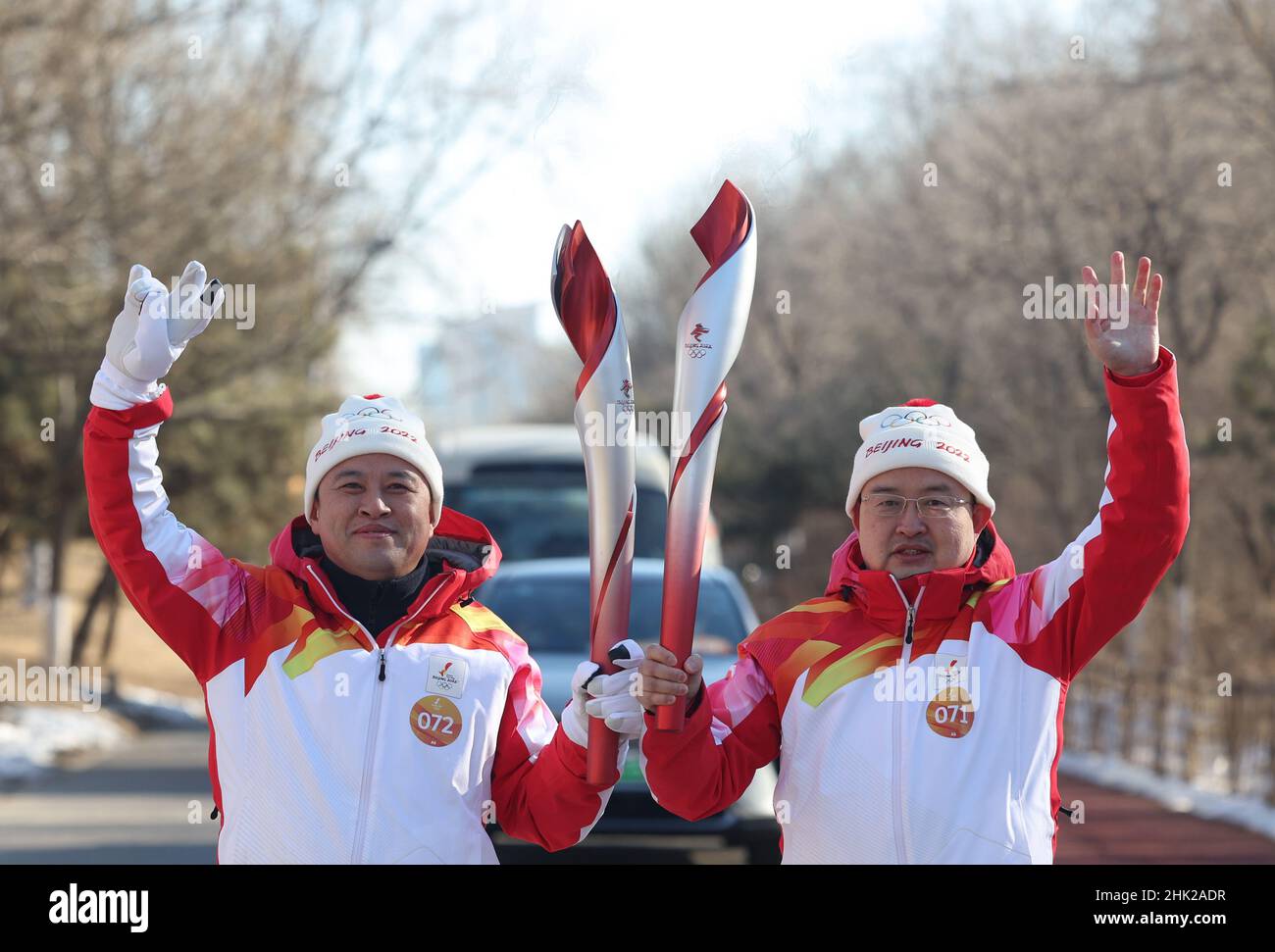 Beijing, China. 2nd Feb, 2022. Torch bearers Zhang Mingdong (R) and ...
