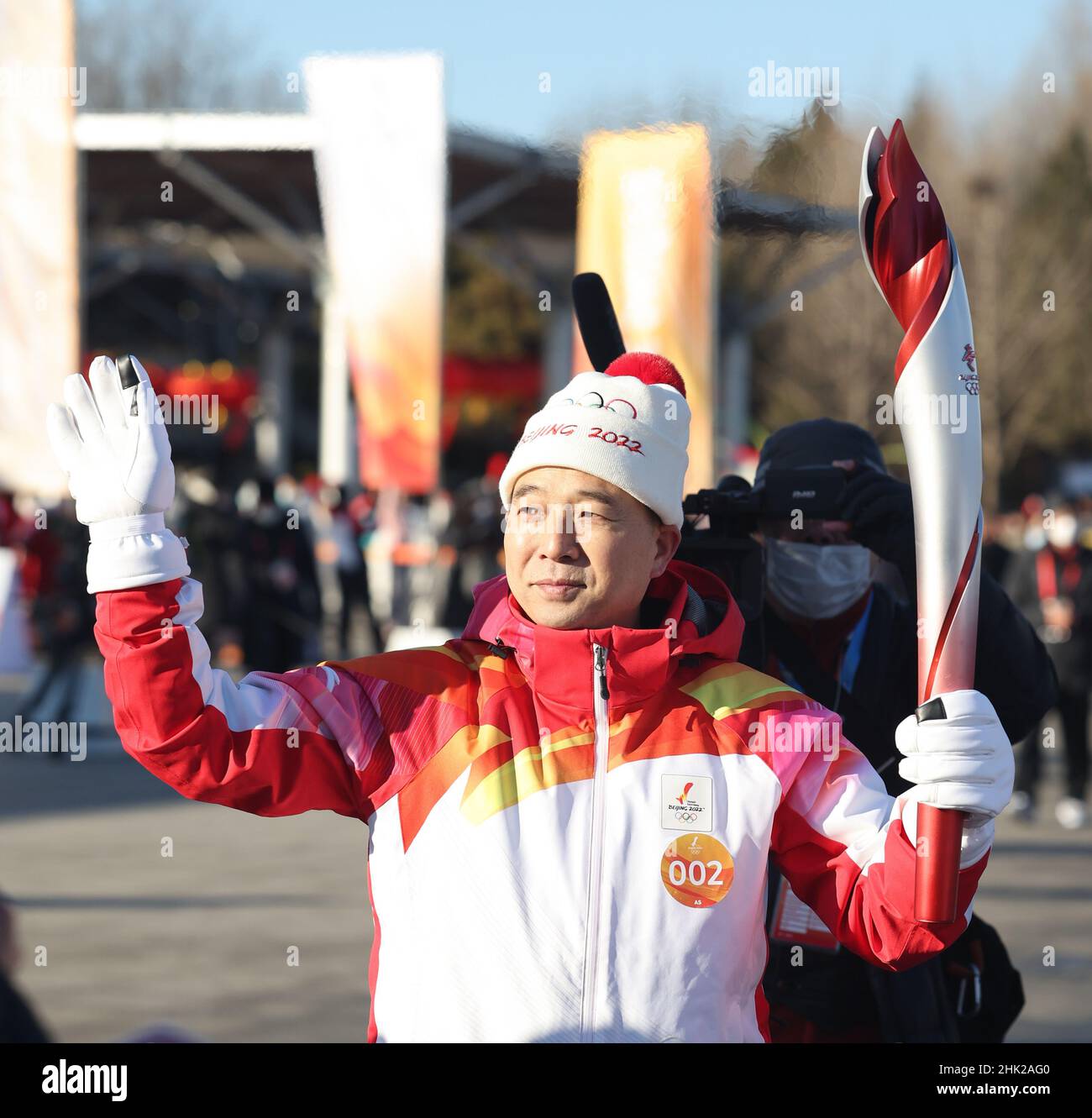Beijing, China. 2nd Feb, 2022. Torch bearer Jing Haipeng runs with the torch during the Beijing ...
