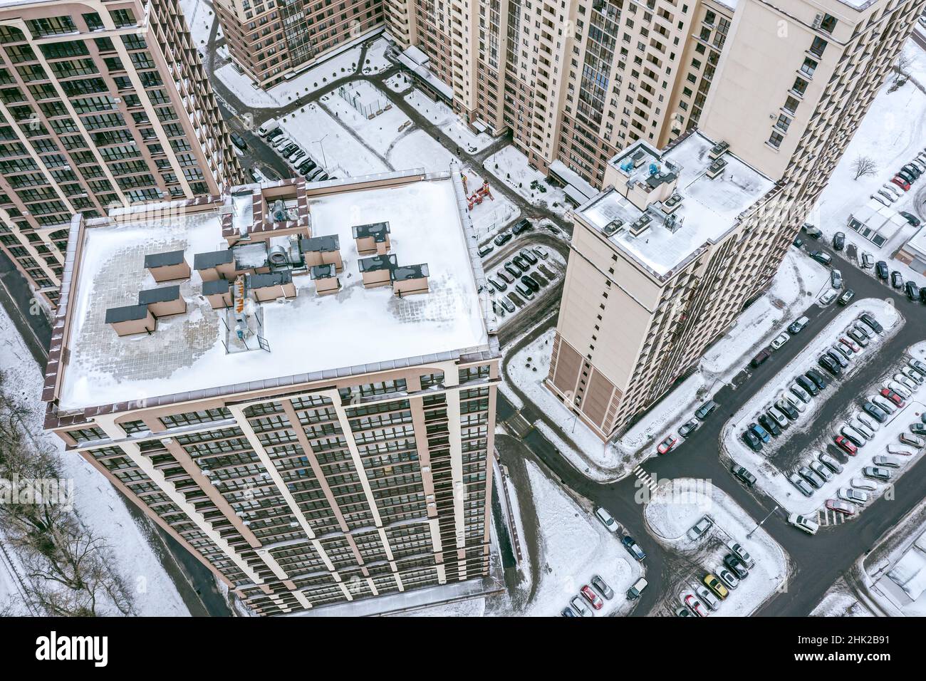 top down aerial view of multistory apartment complex in winter. snow ...