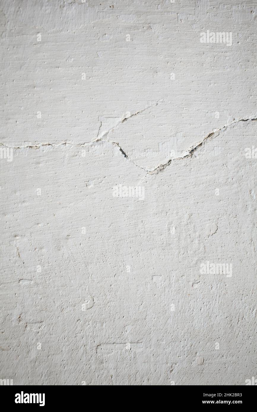 Rough lime wall coating with cracks in the loft style Stock Photo - Alamy