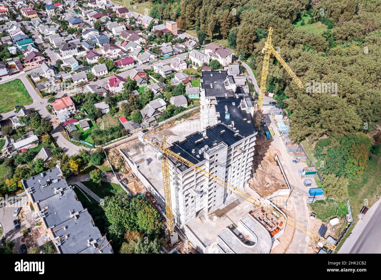 construction of high-rise apartment building in suburb residential area ...