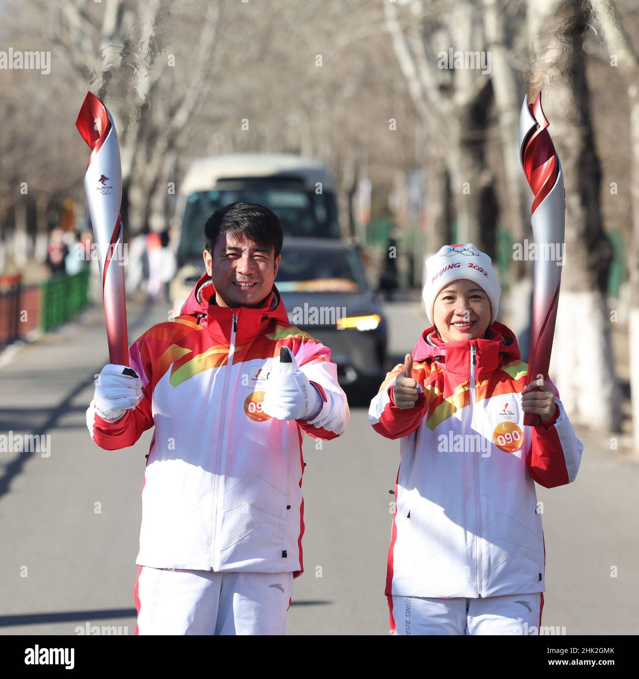 Beijing, China. 2nd Feb, 2022. Torch bearers Wang Yuepeng (L) and Li Xiaohua attend the Beijing ...