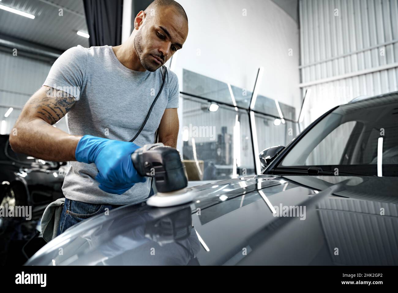 Car detailing man orbital polisher hi-res stock photography and images ...