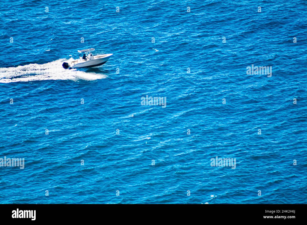 A speedboat in the deep blue ocean Stock Photo - Alamy