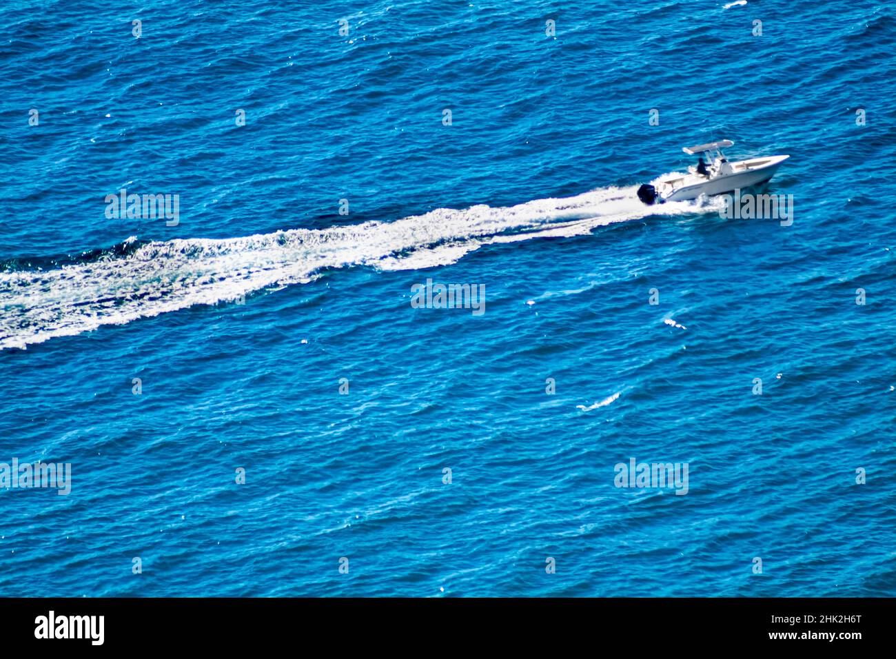 A speedboat in the deep blue ocean Stock Photo - Alamy