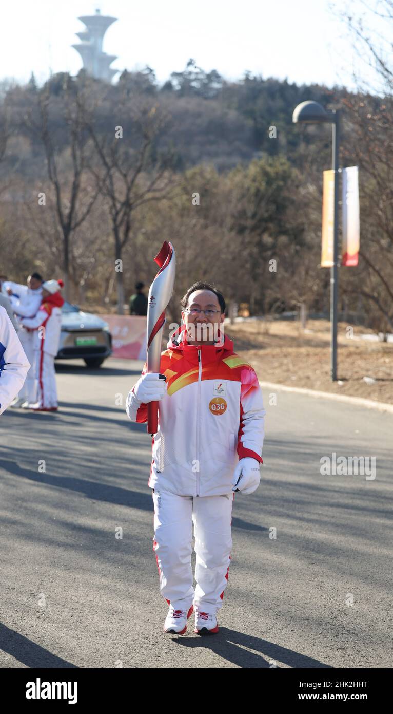 Beijing, China. 2nd Feb, 2022. Torch bearer Sun Ning runs with the torch during the Beijing 2022 ...