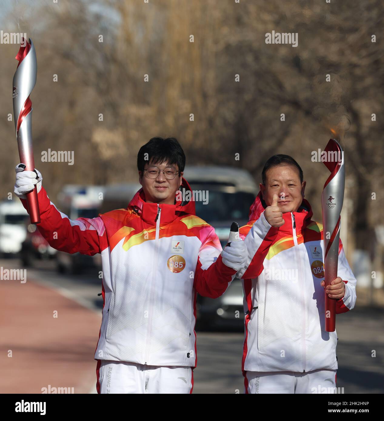 Beijing, China. 2nd Feb, 2022. Torch bearers Bu Pengzhou (R) and Li ...