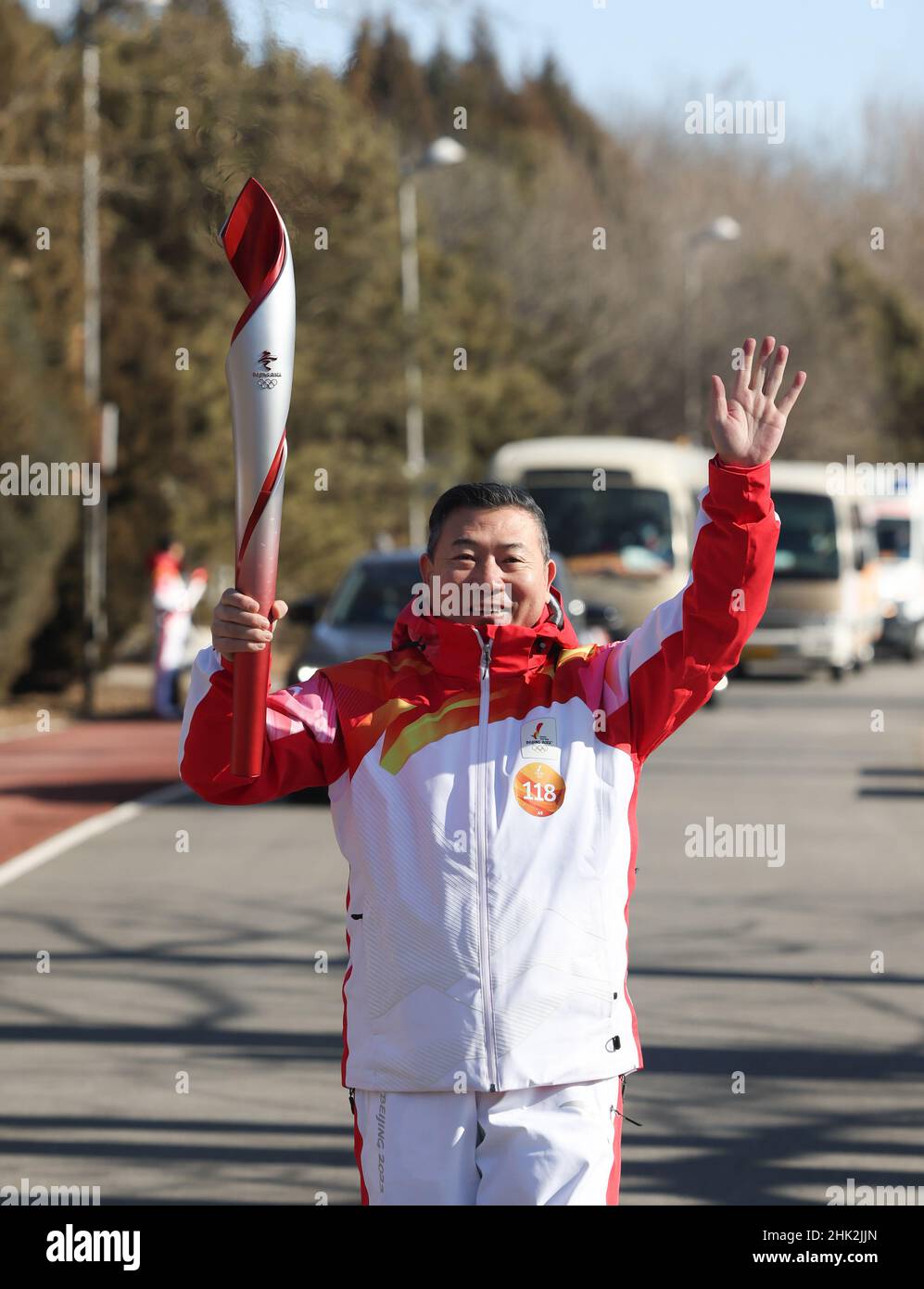 Beijing, China. 2nd Feb, 2022. Torch bearer Li Mingxin runs with the ...