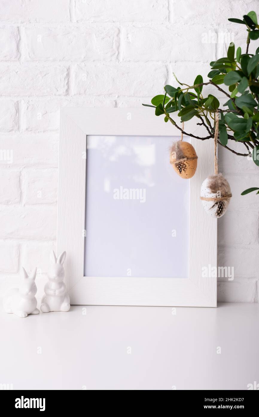 Mock up Photo frame near a white brick wall with Easter decor Stock ...