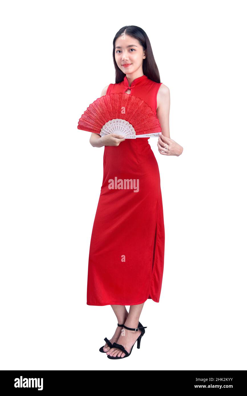 Asian Chinese woman in a cheongsam dress holding fan isolated over ...