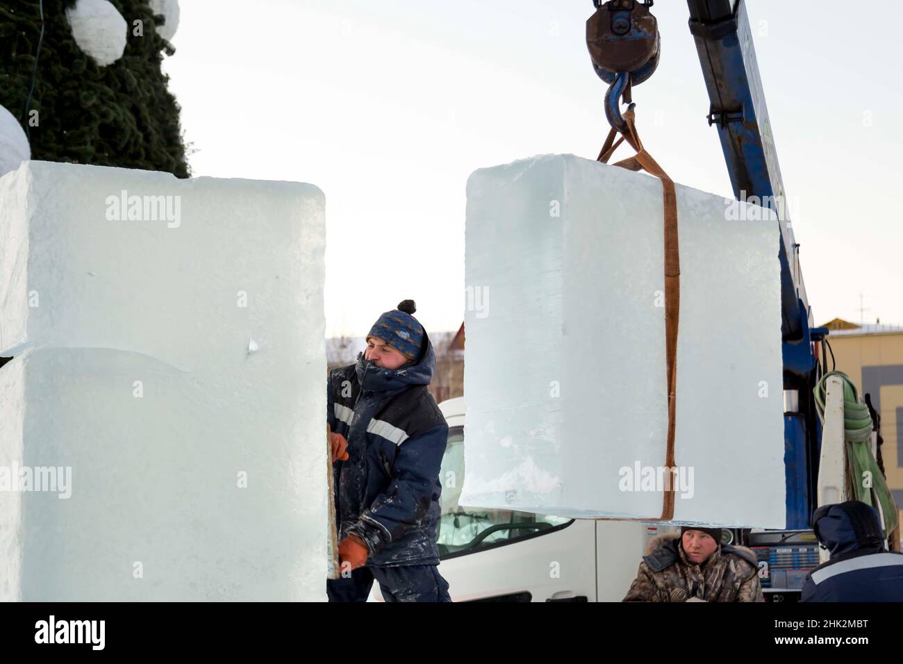 The builder cleans the ice panel with a wire brush from snow Stock ...