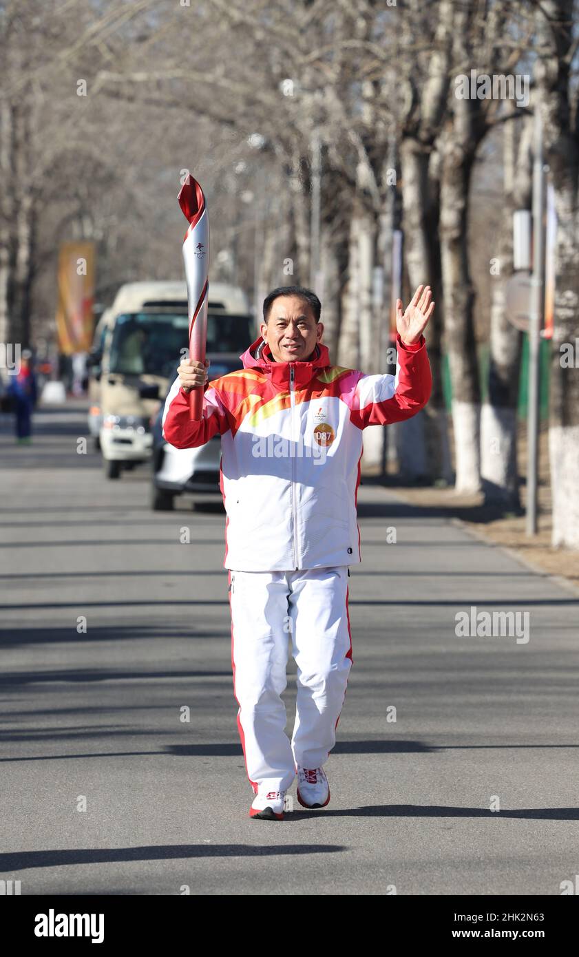Beijing, China. 2nd Feb, 2022. Torch bearer Li Yunpeng runs with the ...