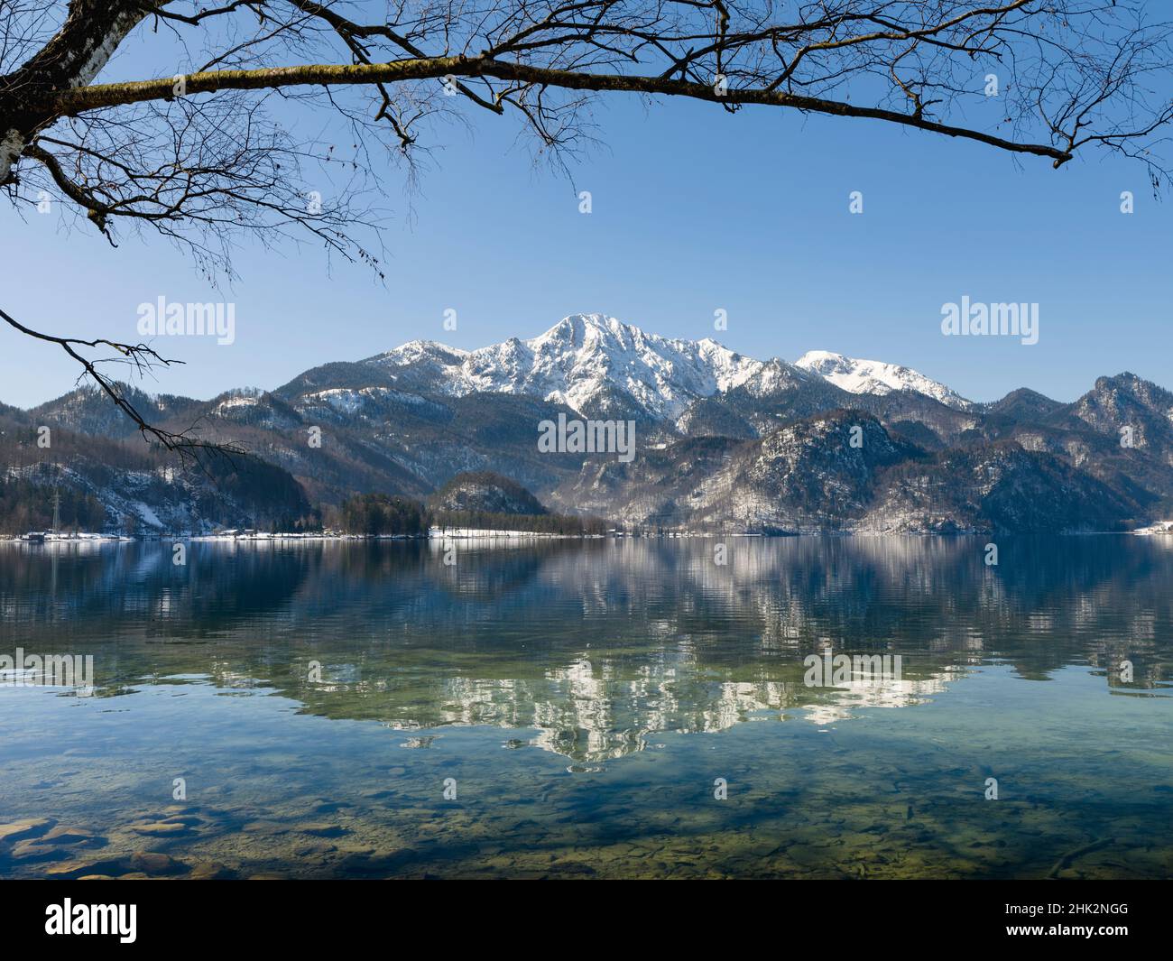 Lake Kochelsee at village Kochel am See during winter in the Bavarian Alps. Mt. Herzogstand in ...